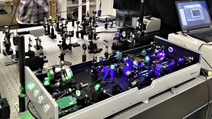 Two-color ultrafast pump-probe system with optical parametric ...